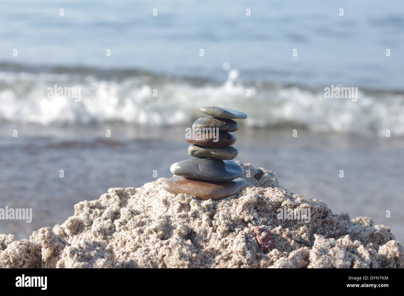 pyramid with six stones on a white background Stock Photo - Alamy