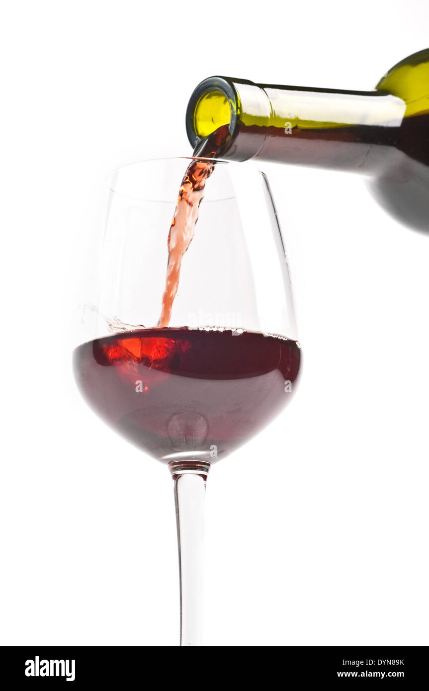 Red wine being poured into wine glass Stock Photo - Alamy