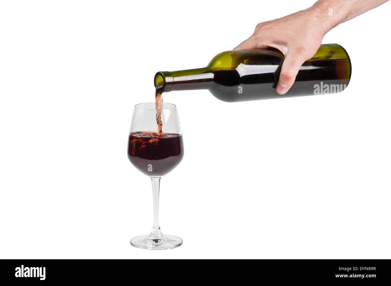 Red wine being poured into wine glass Stock Photo - Alamy
