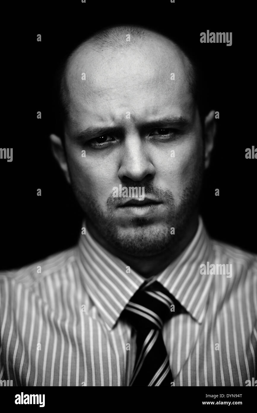 Vertical portrait of serious guy looking at camera Stock Photo - Alamy