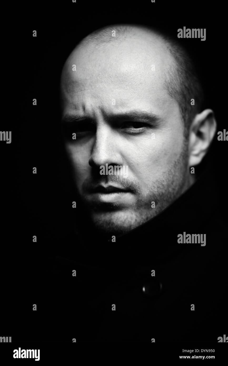 Vertical portrait of serious guy looking at camera Stock Photo - Alamy