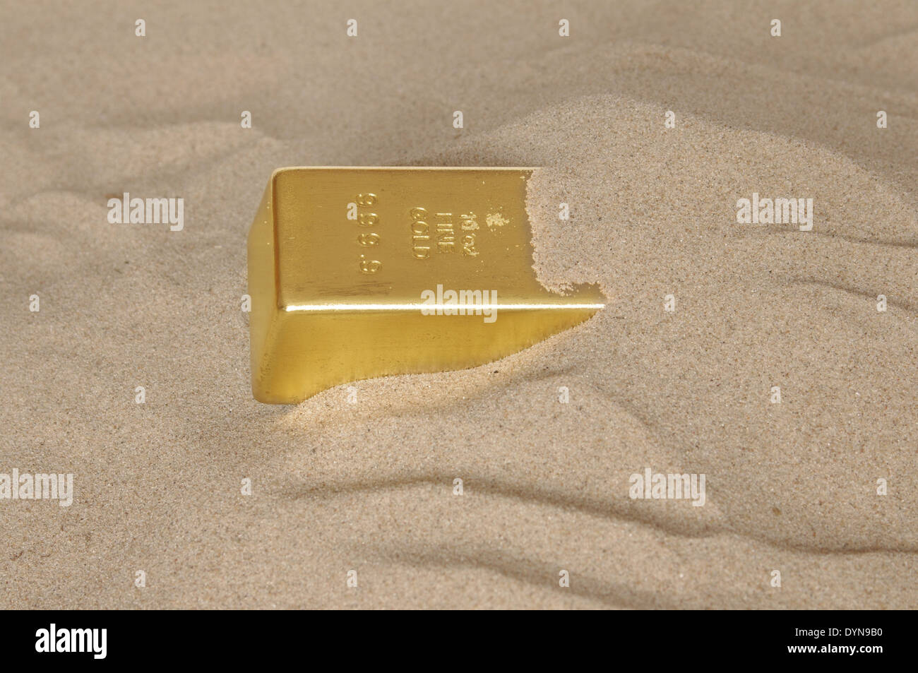 of gold buried in sand bar Stock Photo - Alamy