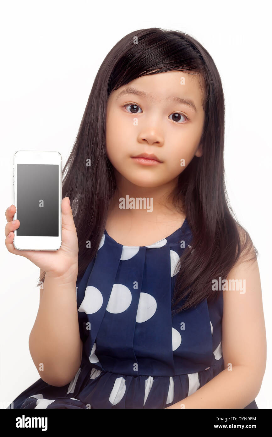 Cute girl with smartphone on white background Stock Photo - Alamy