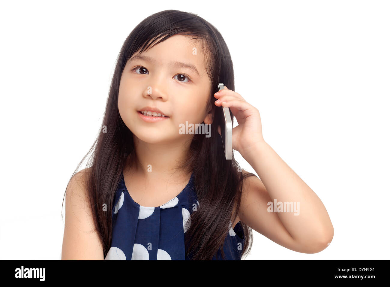 Kid talking on mobile phone on white background Stock Photo - Alamy