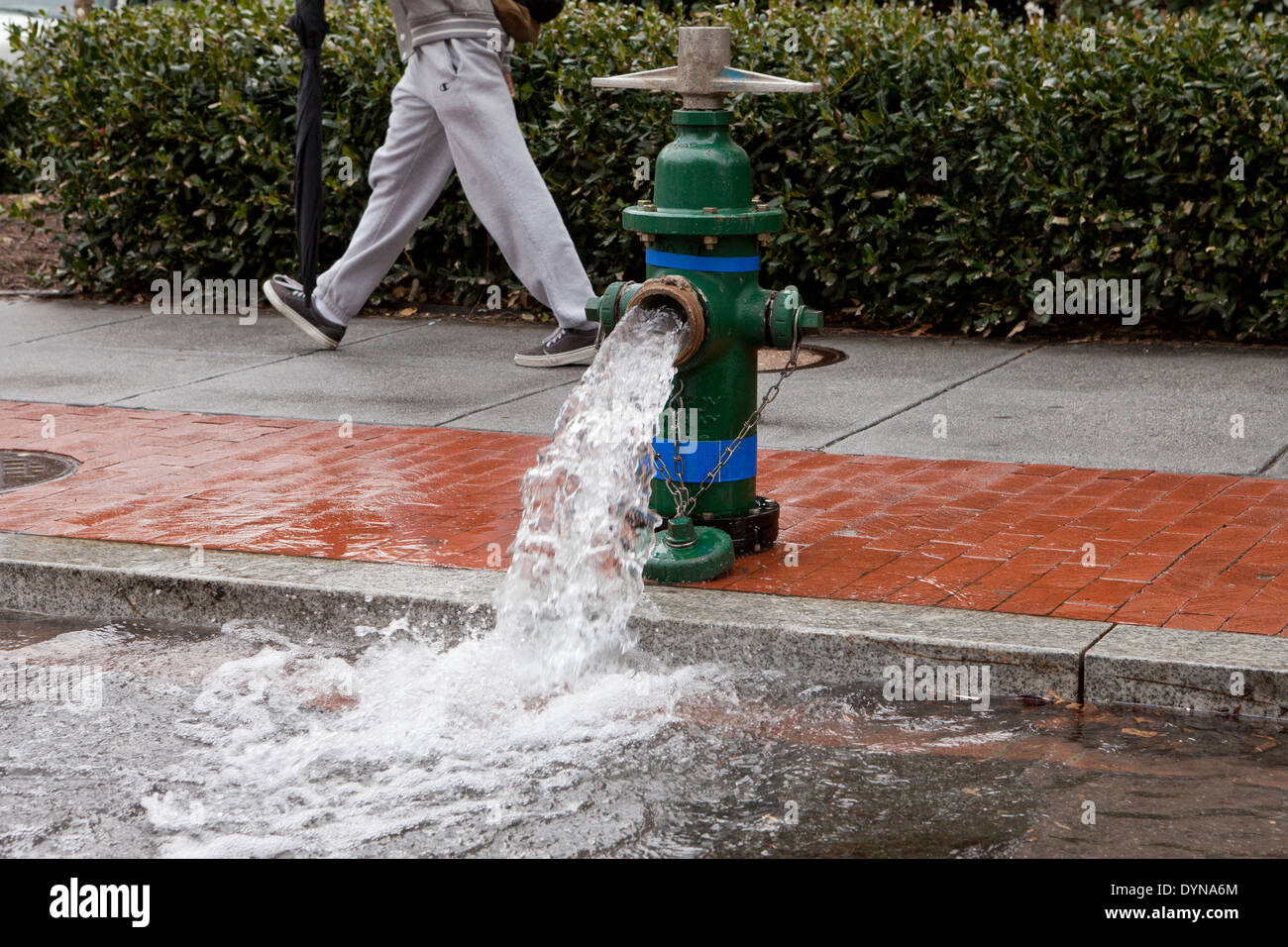 Open fire hydrant valve on city sidewalk - USA Stock Photo - Alamy