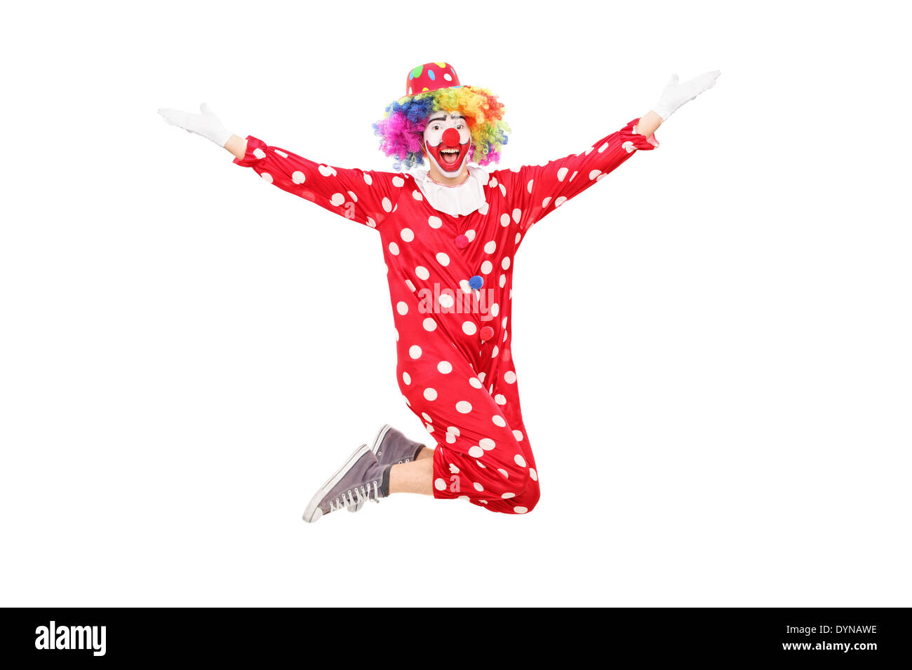 Male clown jumping out of joy Stock Photo - Alamy
