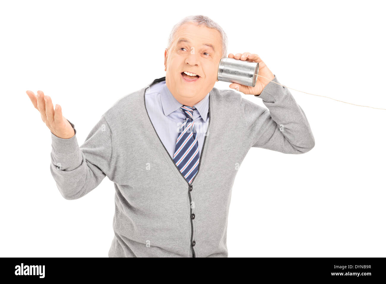 Senior talking through a tin can phone Stock Photo - Alamy