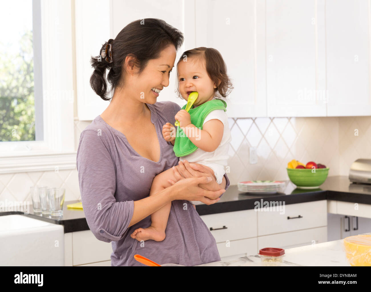 Children mother eating kitchen hi-res stock photography and images - Alamy