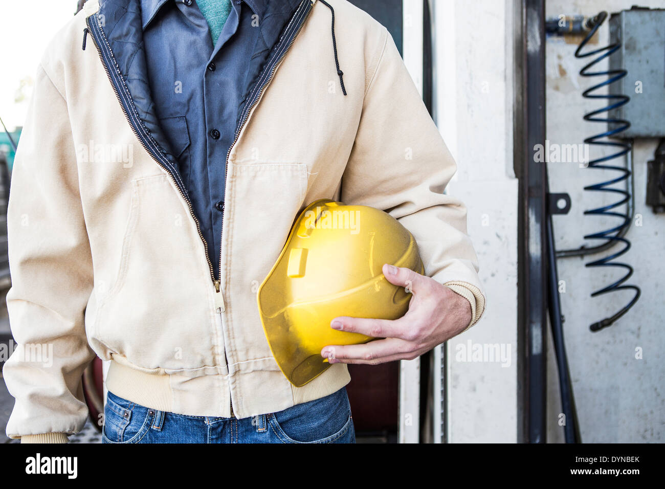 Posing holding hard safety hat hi-res stock photography and images - Alamy