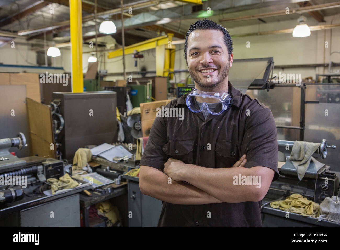 Smiling worker in manufacturing plant hi-res stock photography and ...