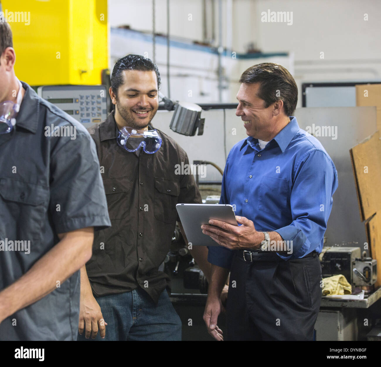 Worker and manager using digital tablet in warehouse Stock Photo - Alamy