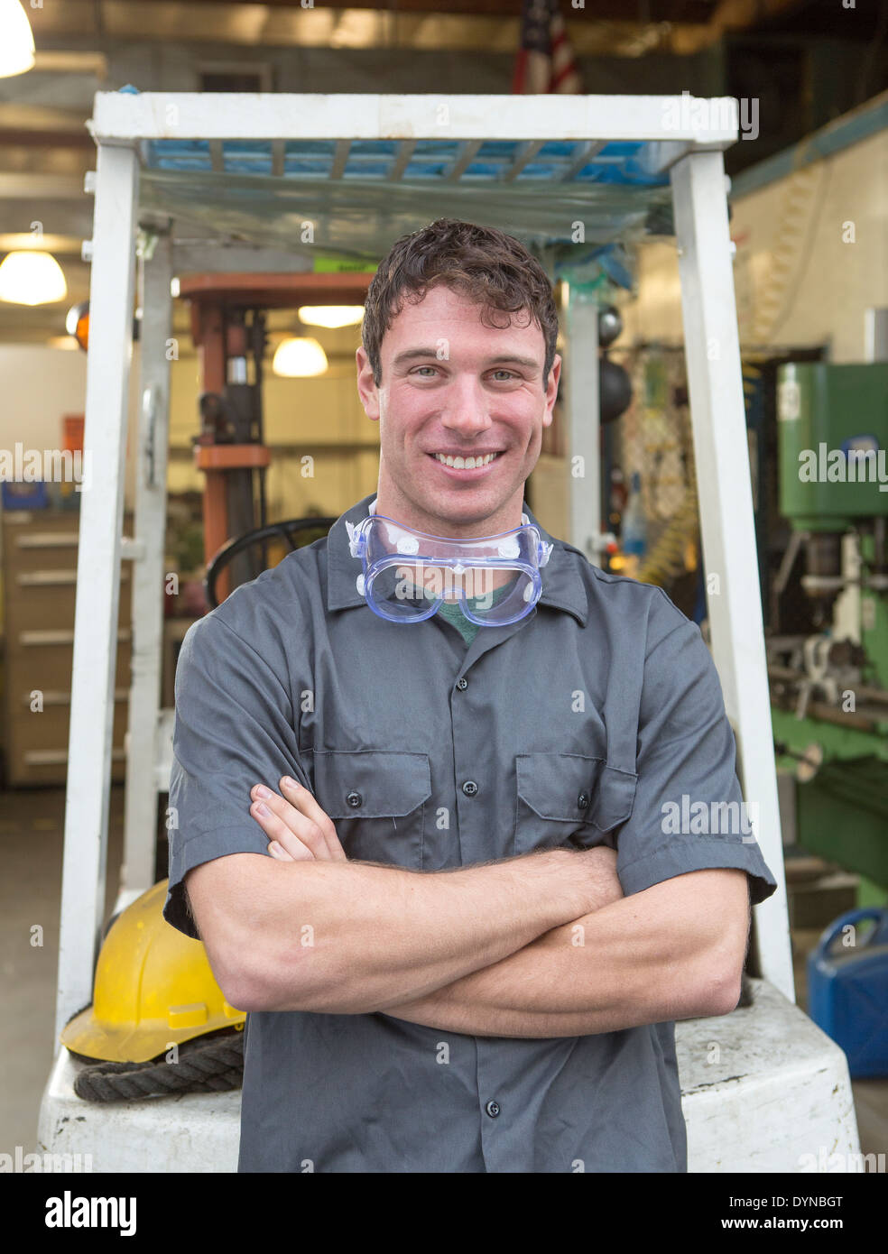 Caucasian worker smiling in warehouse Stock Photo - Alamy