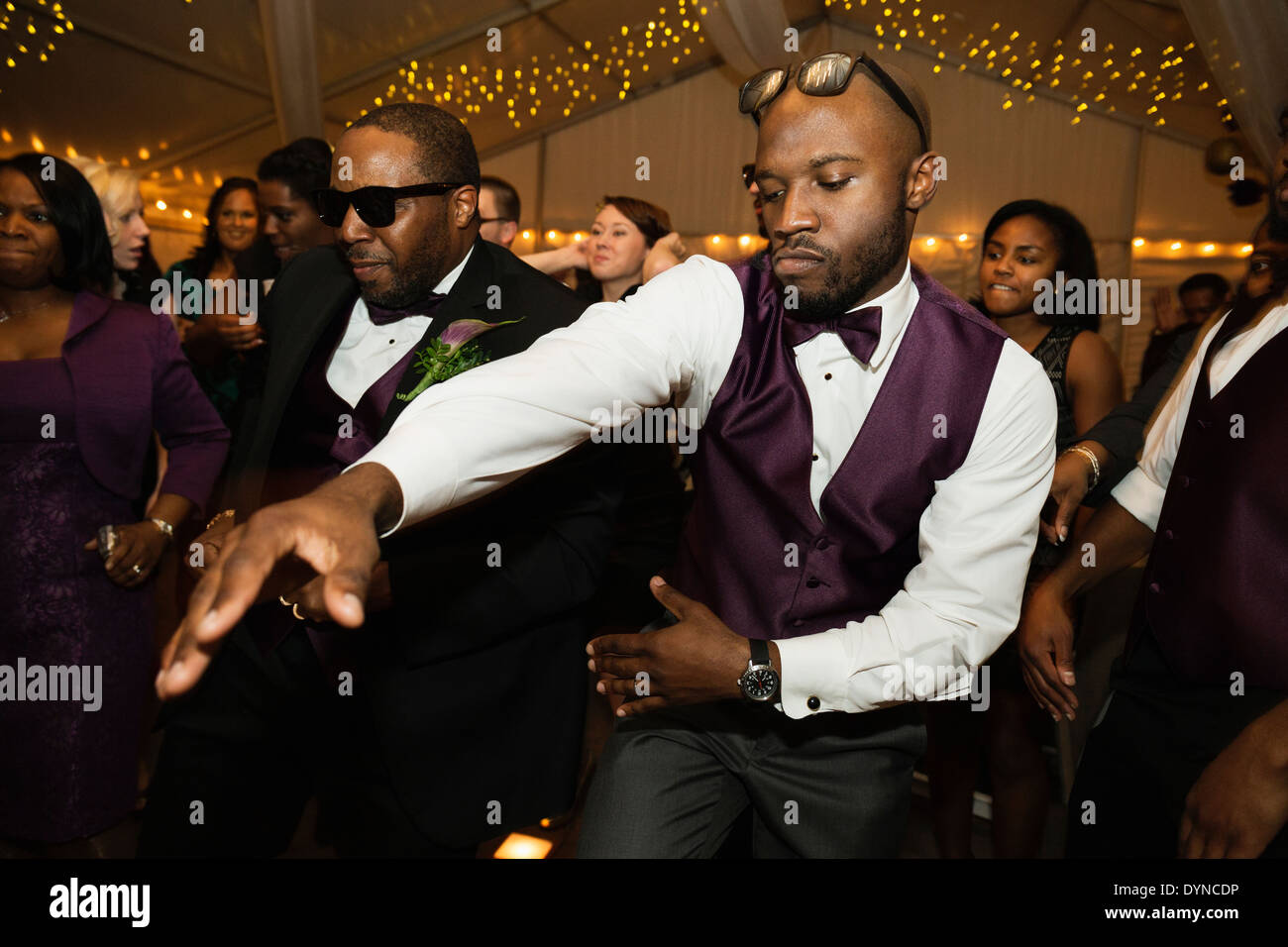 Groom and groomsman dancing at reception Stock Photo - Alamy