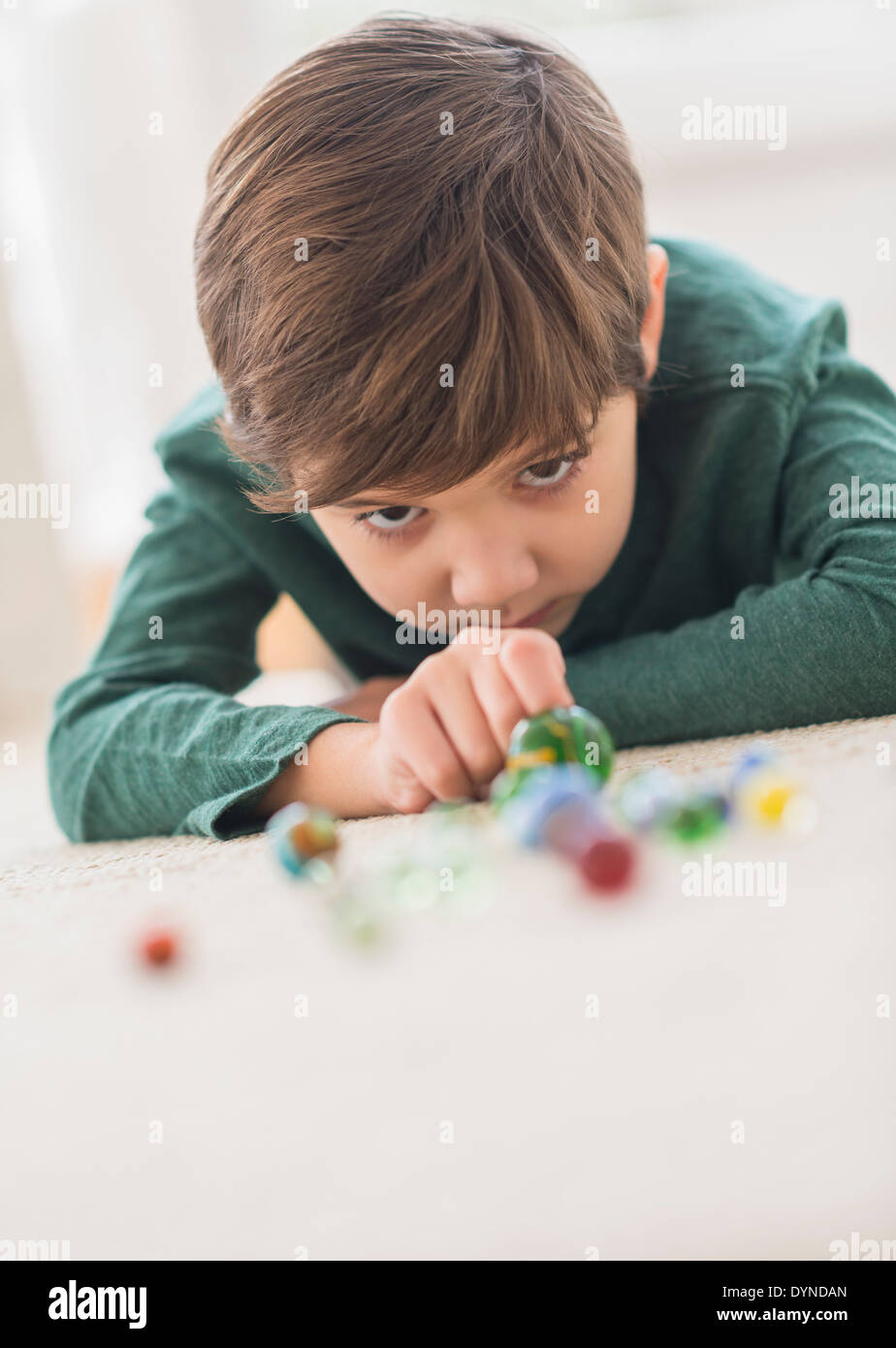 Boy playing marbles hi-res stock photography and images - Alamy