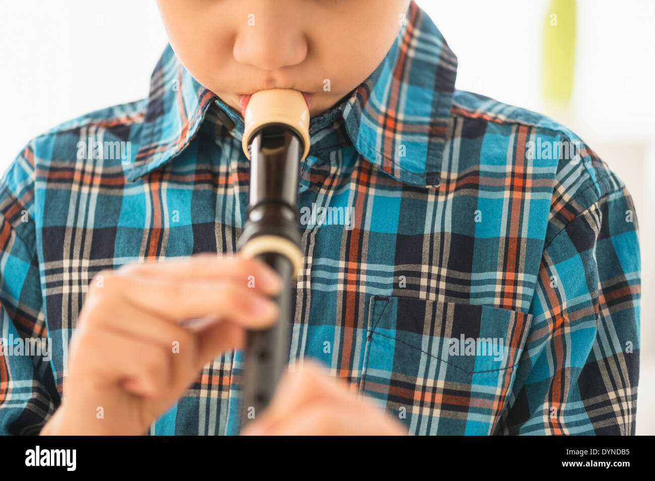 Boy playing recorder hi-res stock photography and images - Alamy