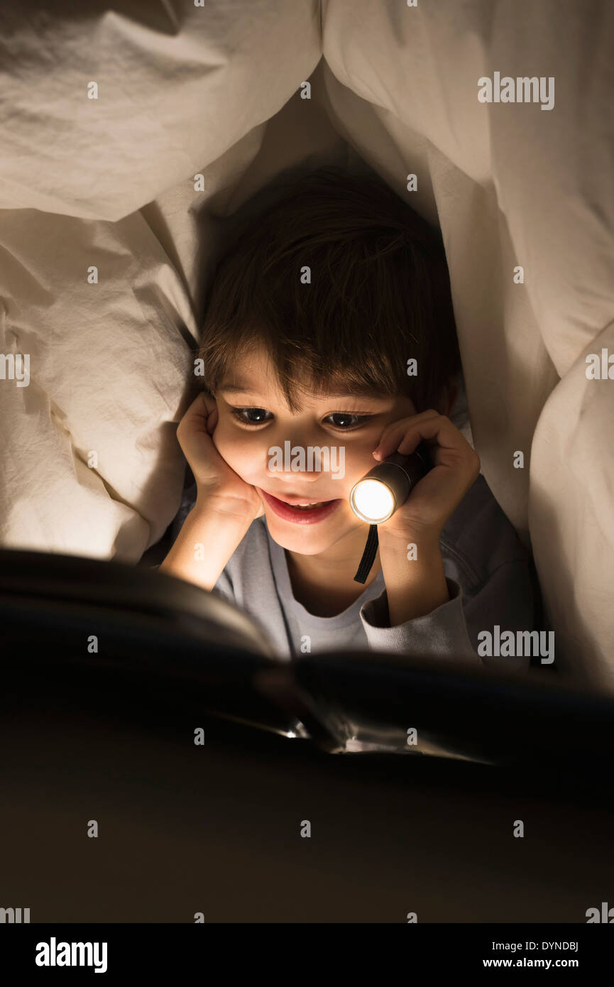 Child book under covers hi-res stock photography and images - Alamy