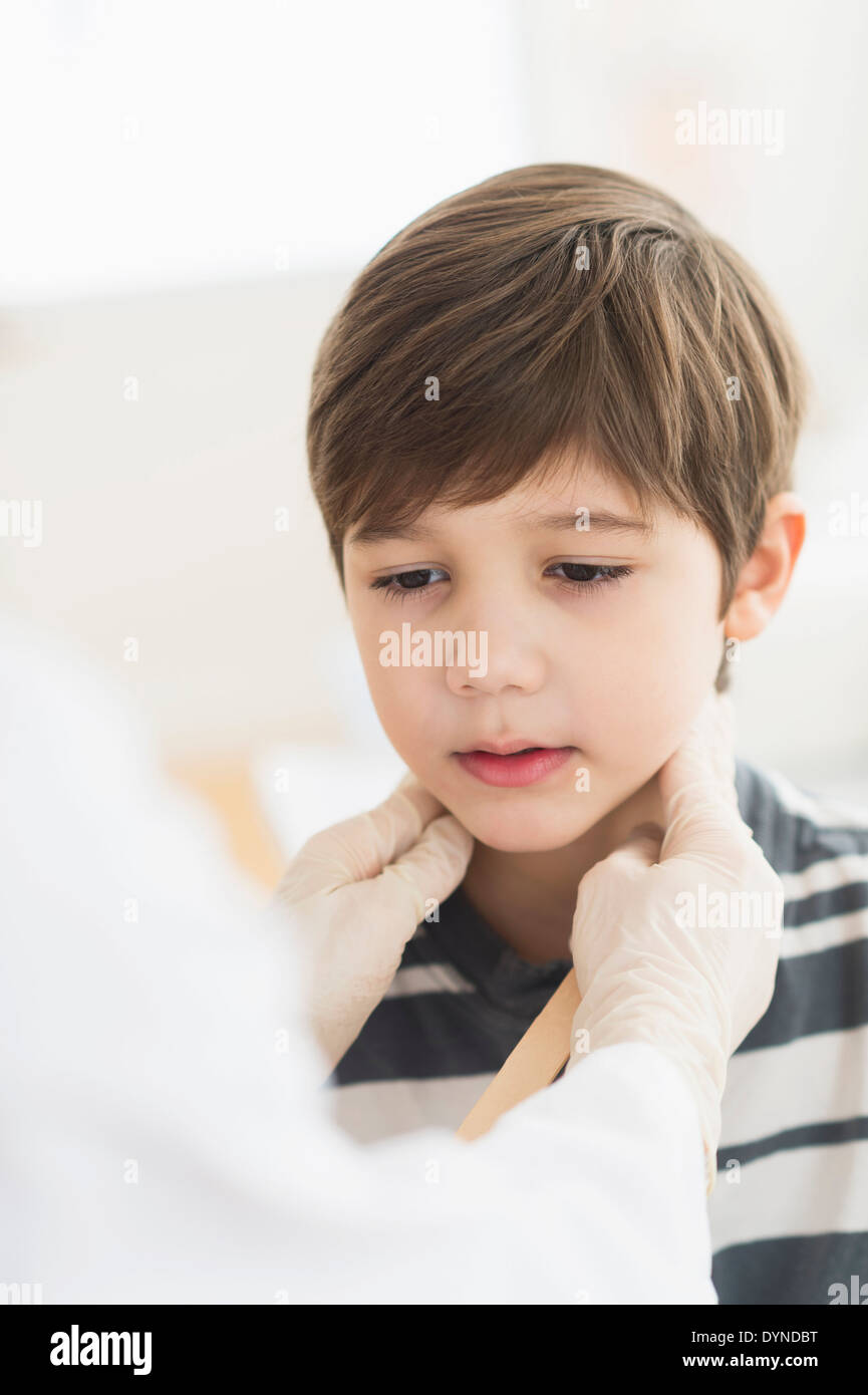 Hispanic boy getting a checkup at doctor's office Stock Photo - Alamy