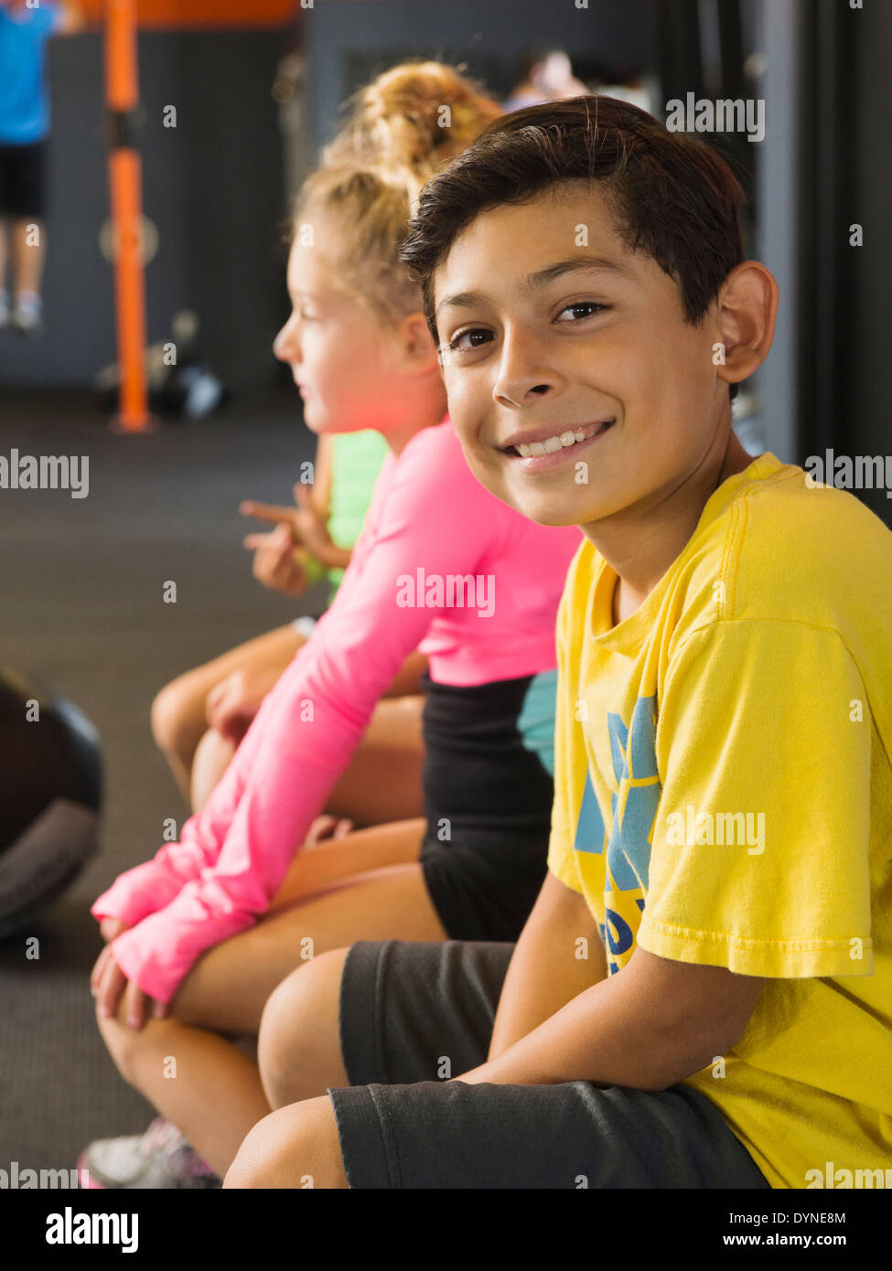 Boy smiling in gym Stock Photo - Alamy