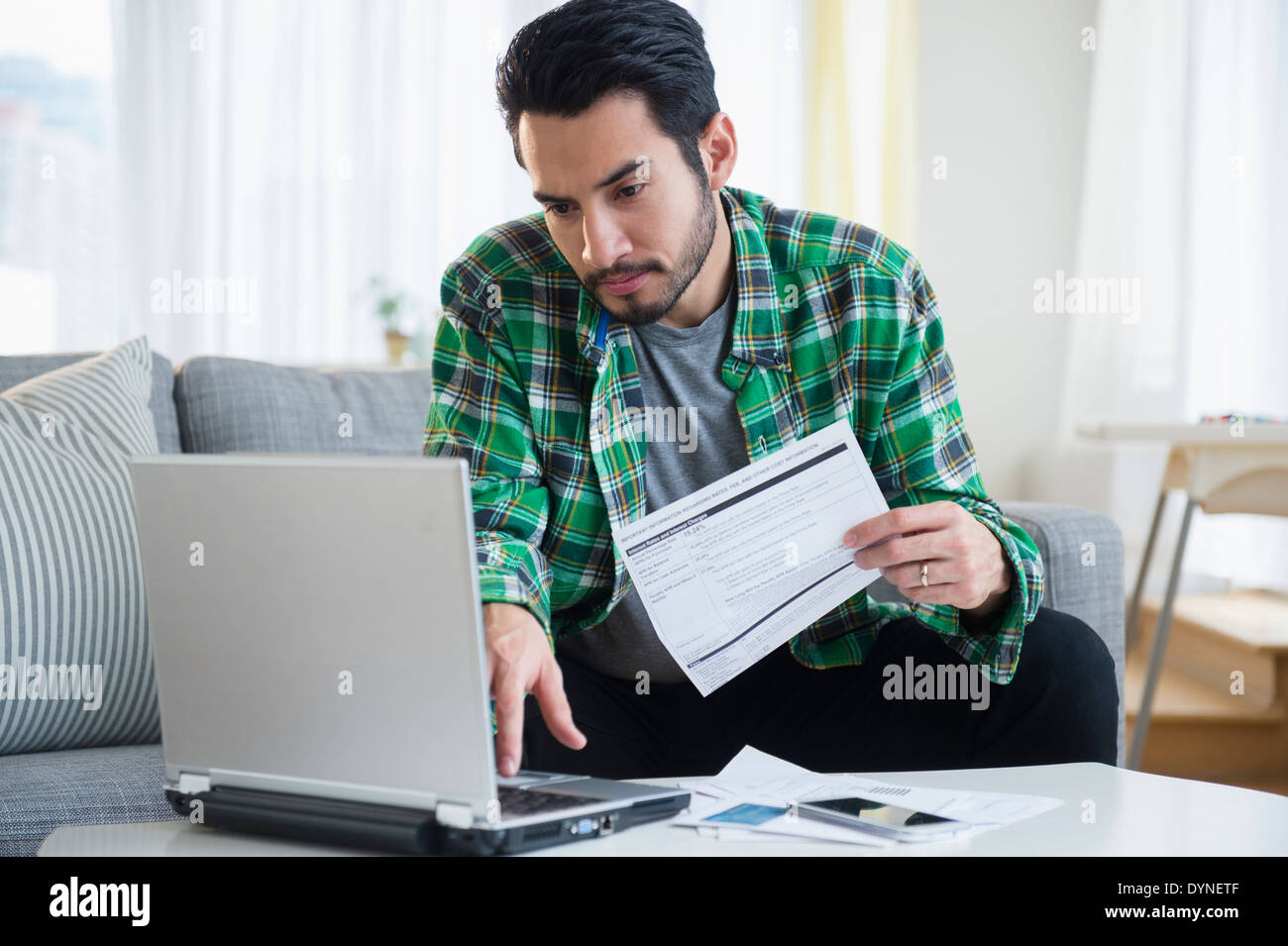 Black man reading bill hi-res stock photography and images - Alamy