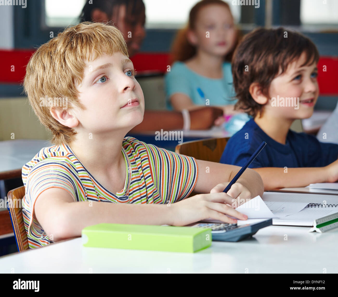 Child writing in class hi-res stock photography and images - Alamy
