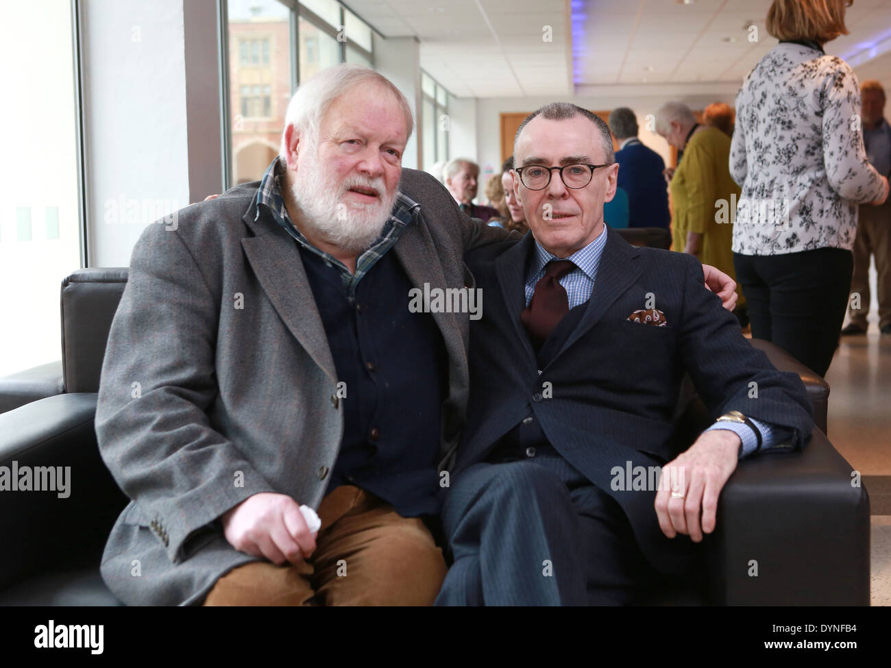 Ciaran Carson (right) shares a sofa, has he laughs with friend Michael ...