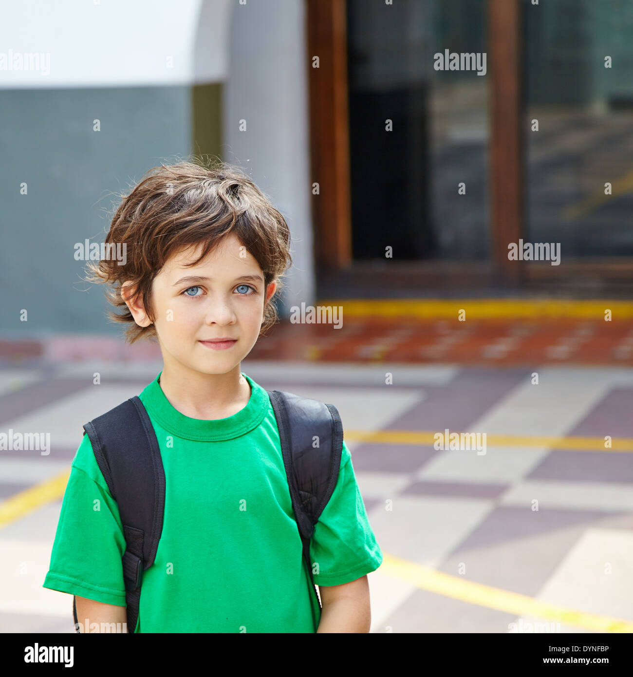 Boy standing on schoolyard in an elementary school Stock Photo - Alamy