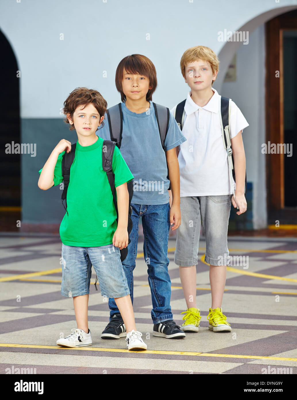 Three children stand hi-res stock photography and images - Alamy