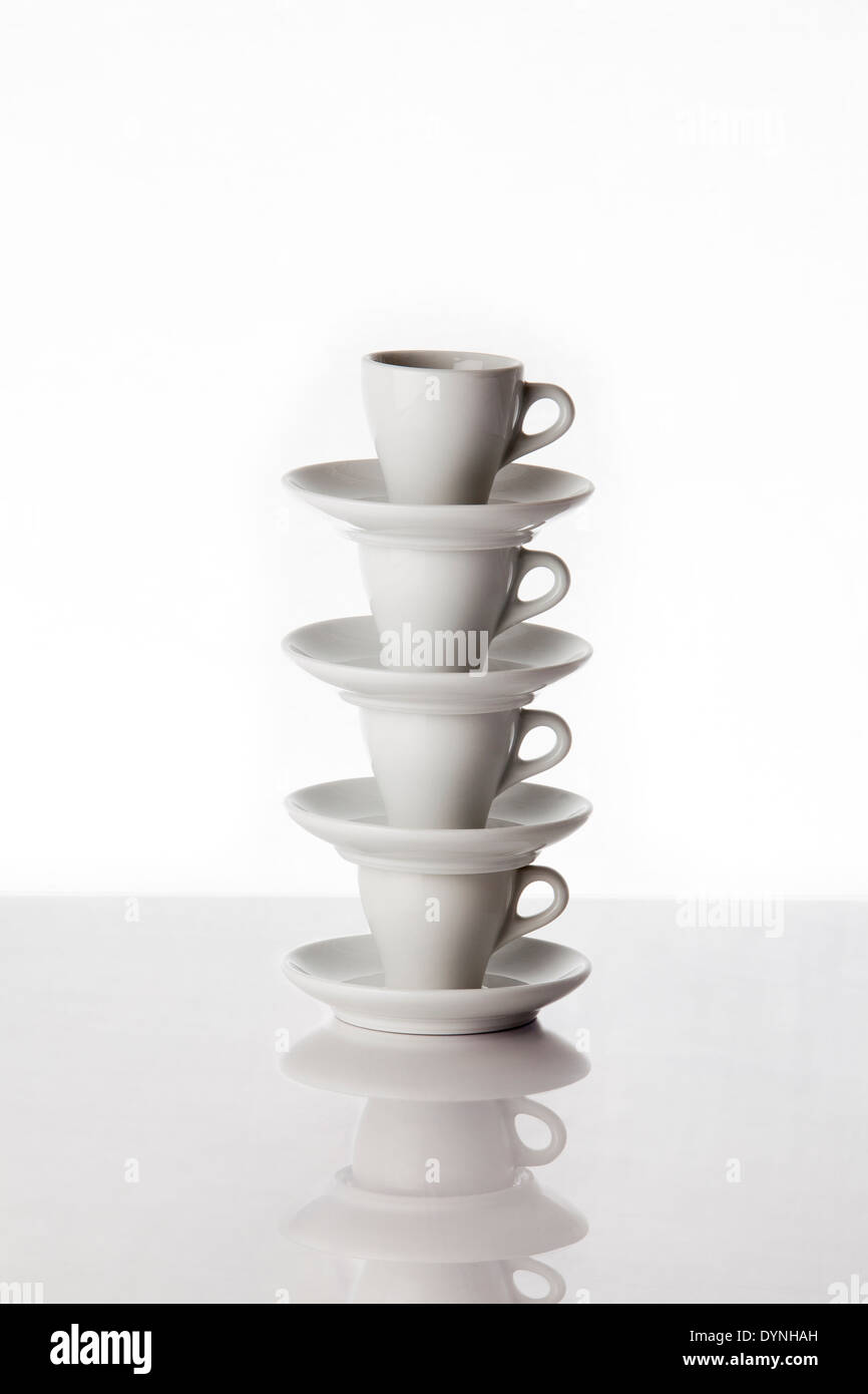 Pile of four coffee plates and cups Stock Photo - Alamy