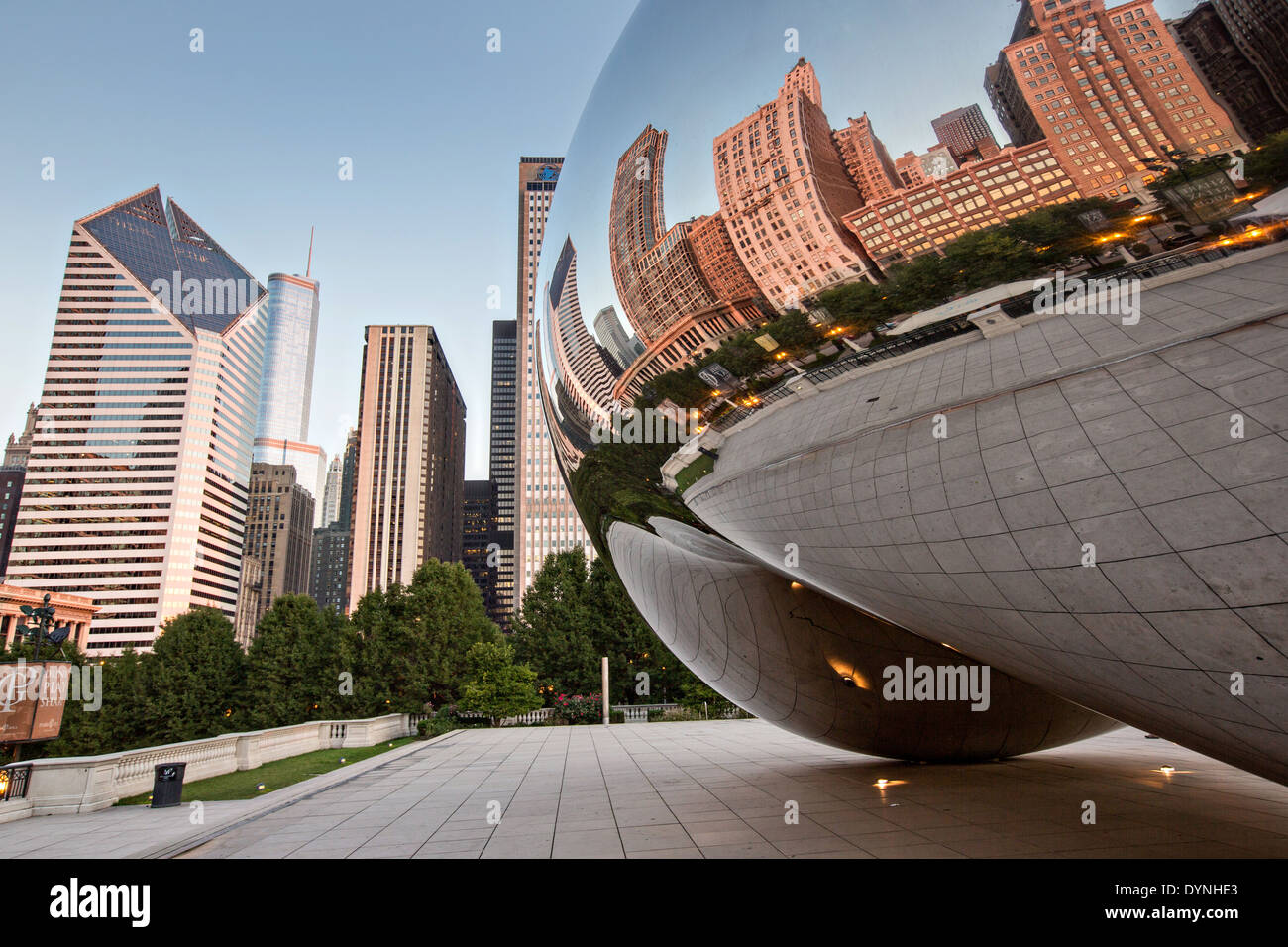 Cloud Gate Sculpture or The Bean with downtown skyline reflected in ...
