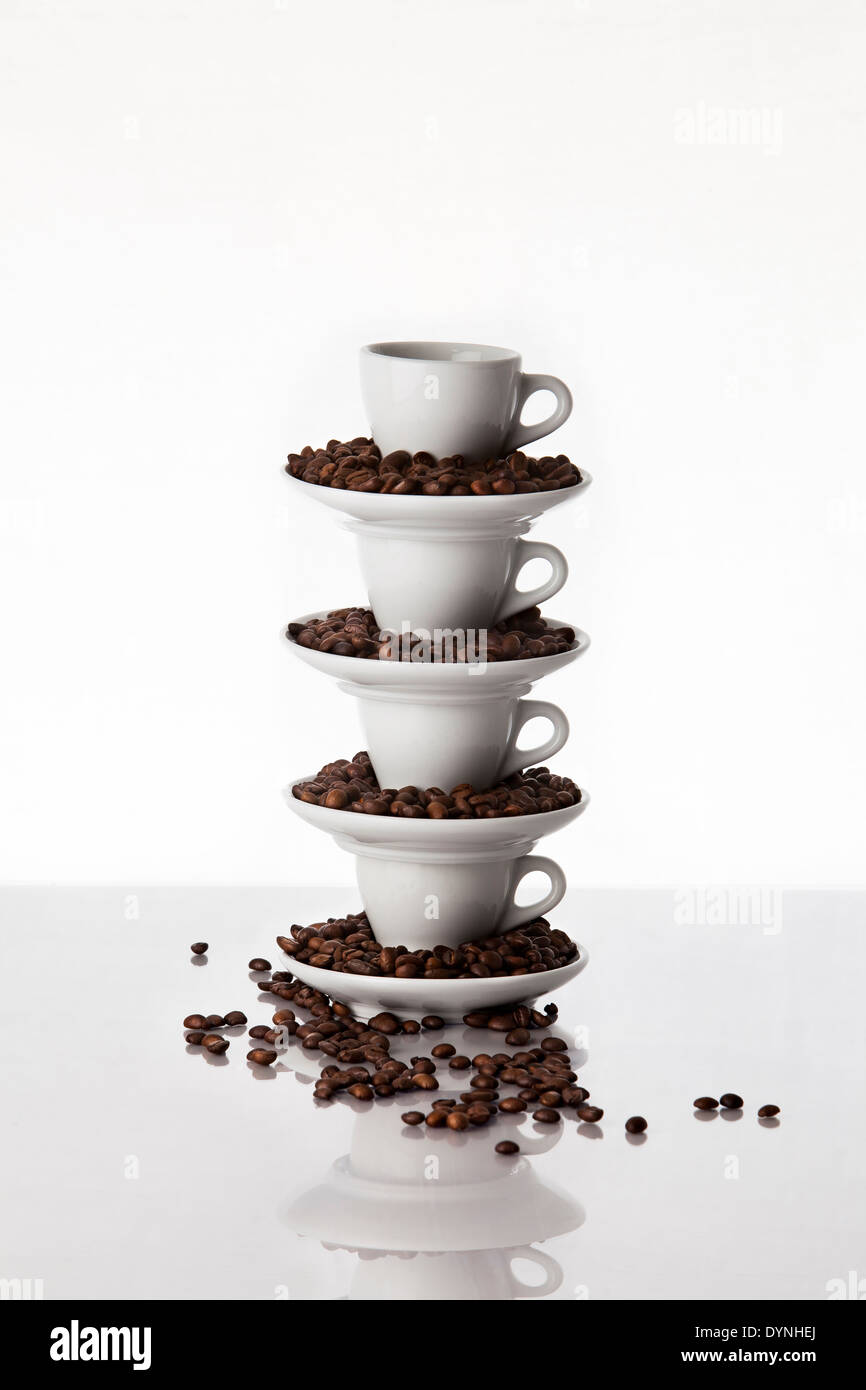 Espresso cup filled with roasted coffee beans hi-res stock photography ...
