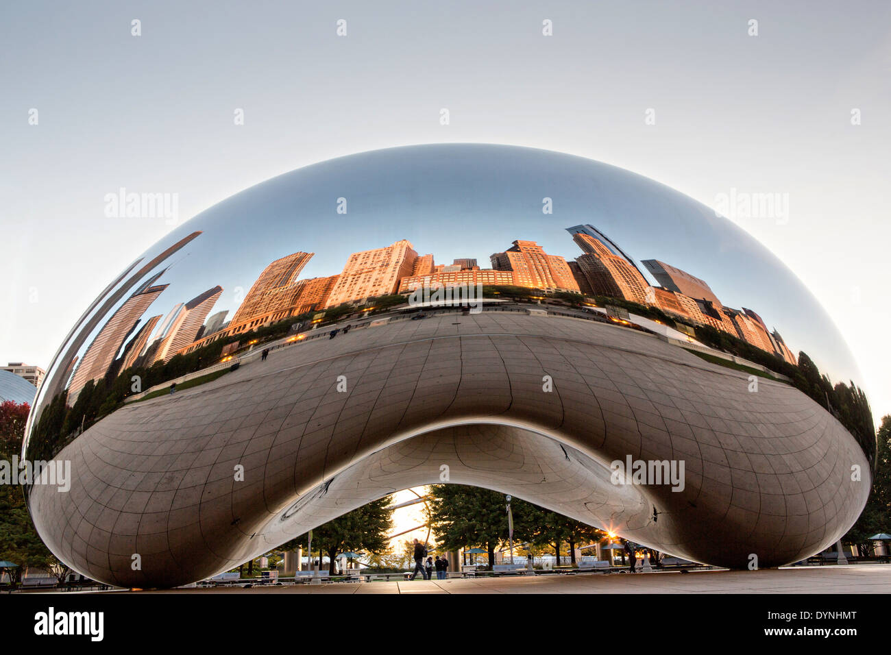 Cloud Gate Sculpture or The Bean with downtown skyline reflected in ...