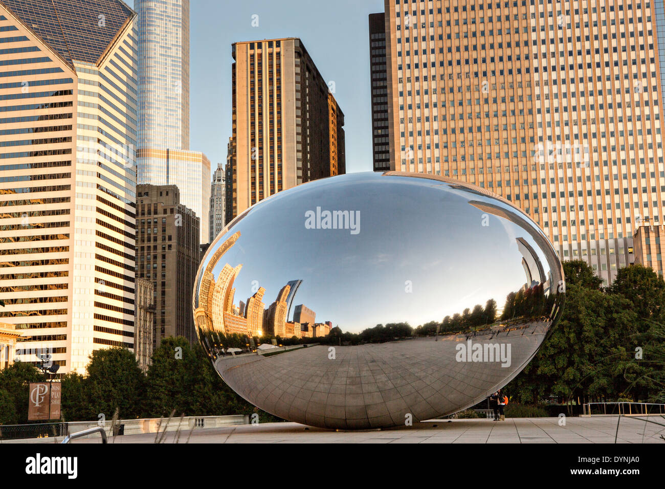 Cloud Gate Sculpture or The Bean with downtown skyline reflected in ...