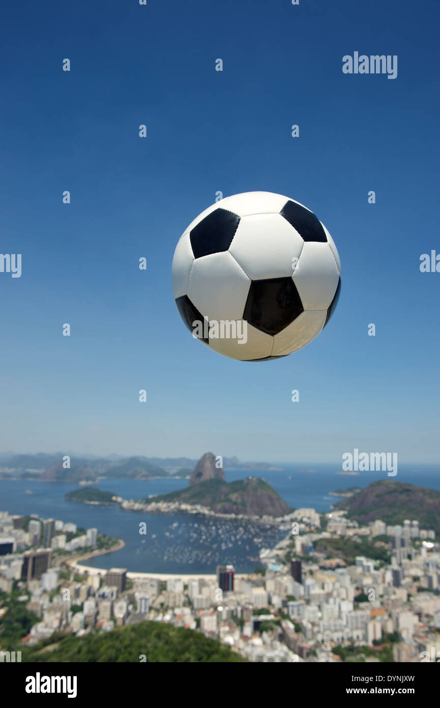Football soccer ball above Rio de Janeiro skyline with Sugarloaf Pao de ...