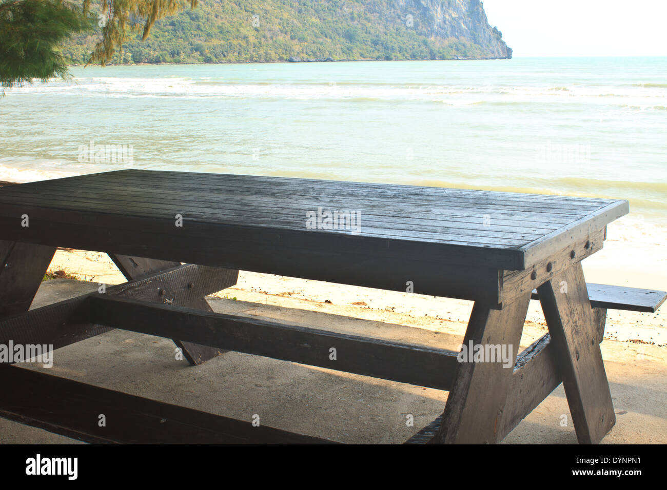 Outdoors Picnic table by the beach with sea ocean background Stock ...