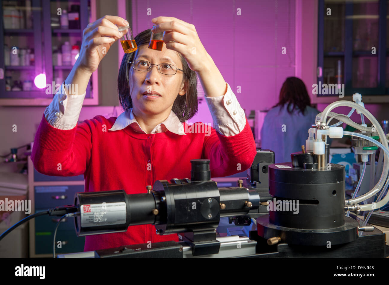 Scientist in Lab, holding up vials of liquid College Park, Maryland ...