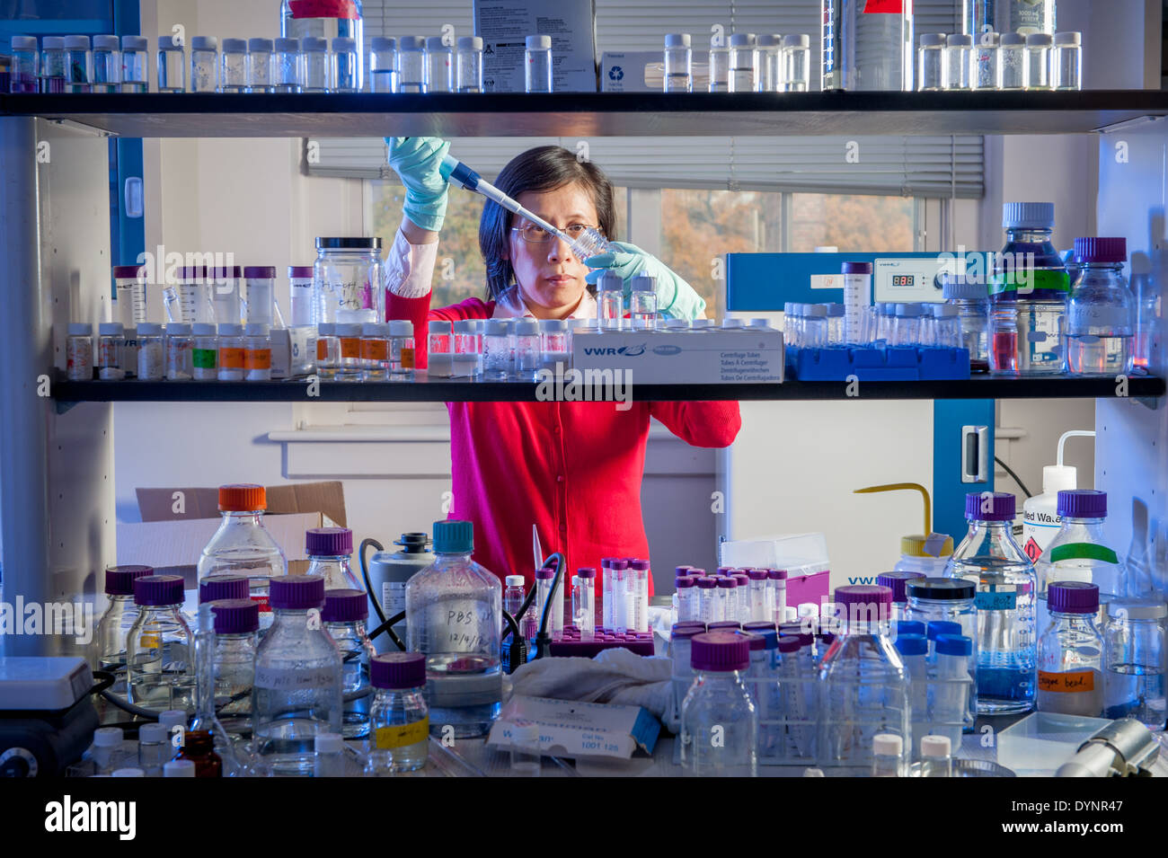 Female scientist looking liquid hi-res stock photography and images - Alamy
