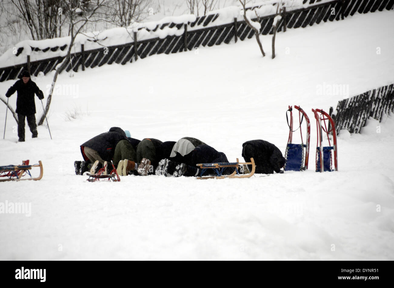 Muslim immigrants to Norway praying toward Mecca in the snow on a visit ...