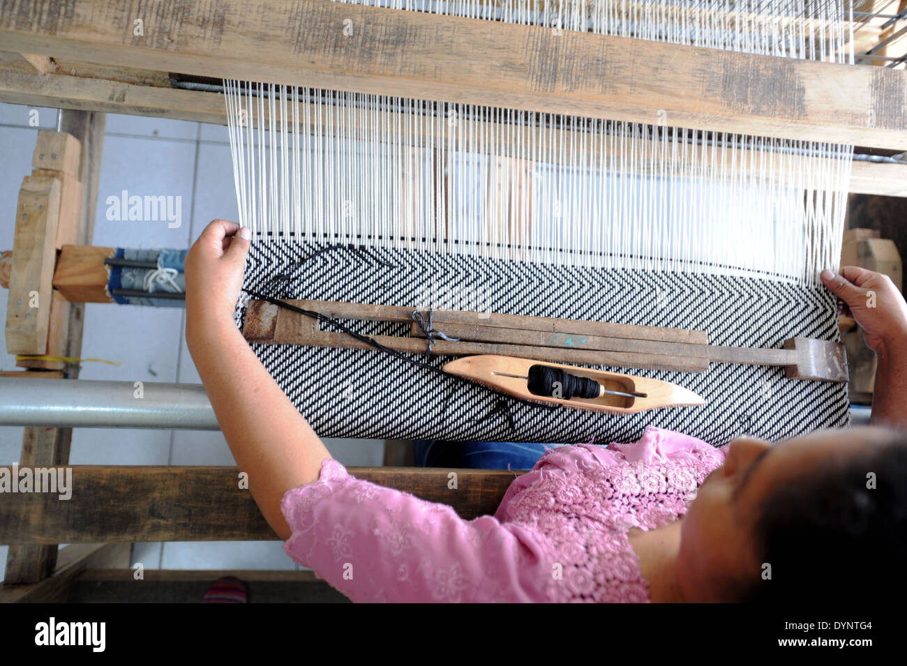 Mayan woman weaving on loom in Guatemala City, Guatemala Stock Photo ...