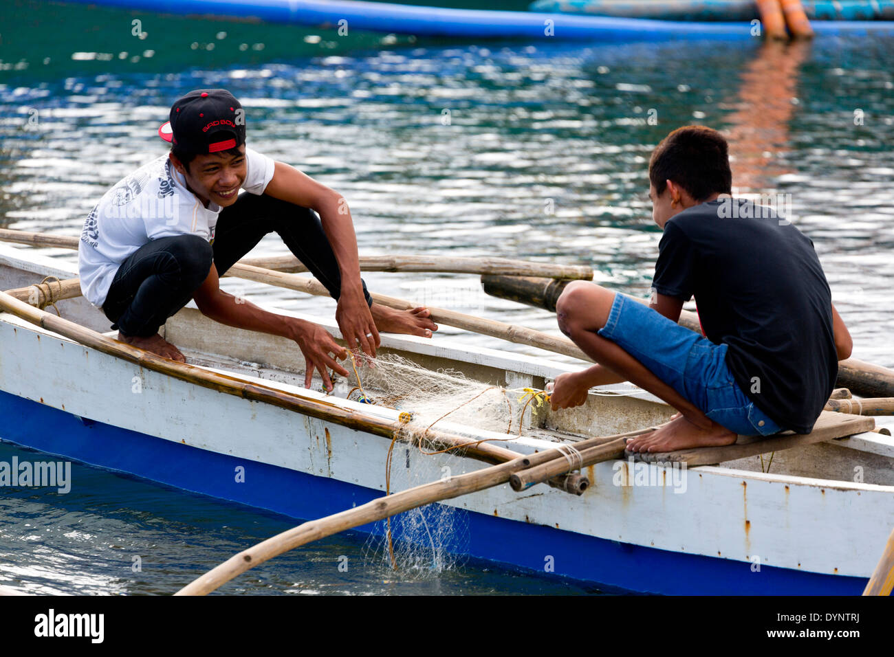 Fishing Boys on a Boat in the Port of Mangingisda in Puerto Princesa ...