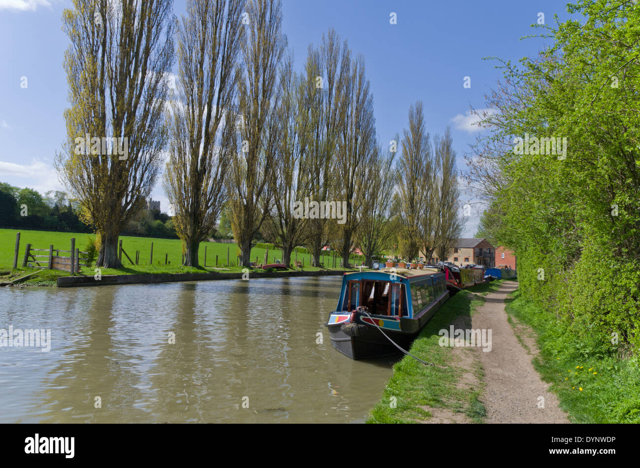 Colourful narrow boats moored on the Grand Union Canal, Cosgrove; a ...