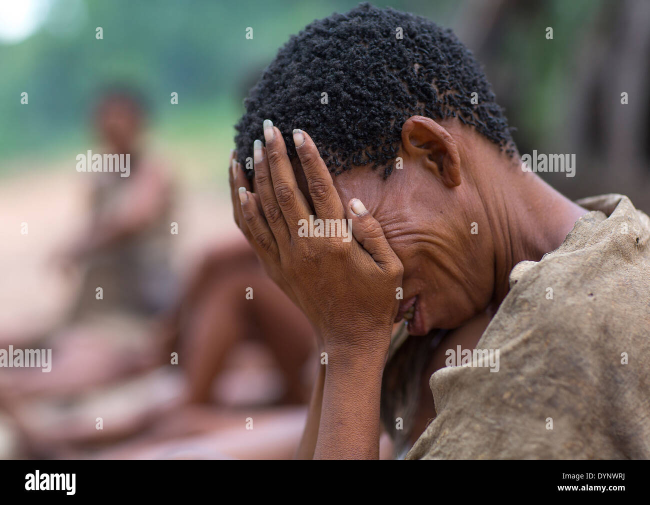 Bushman Woman Holding Her Head, Tsumkwe, Namibia Stock Photo - Alamy