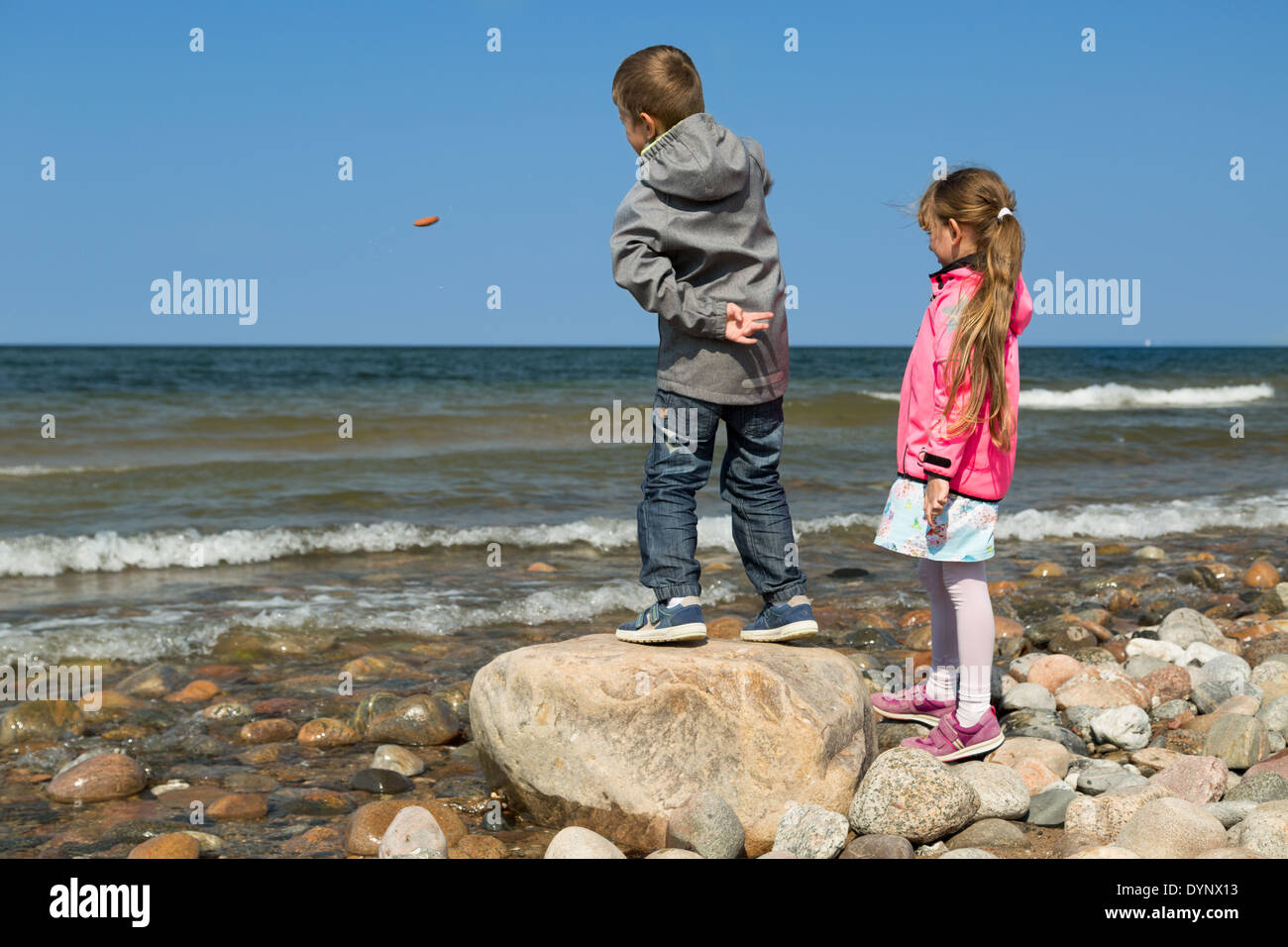 Children throwing rocks hi-res stock photography and images - Alamy