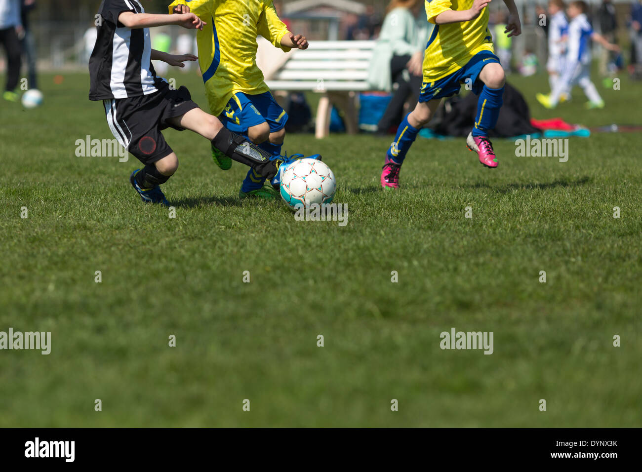 Boys playing soccer on pitch hi-res stock photography and images - Alamy