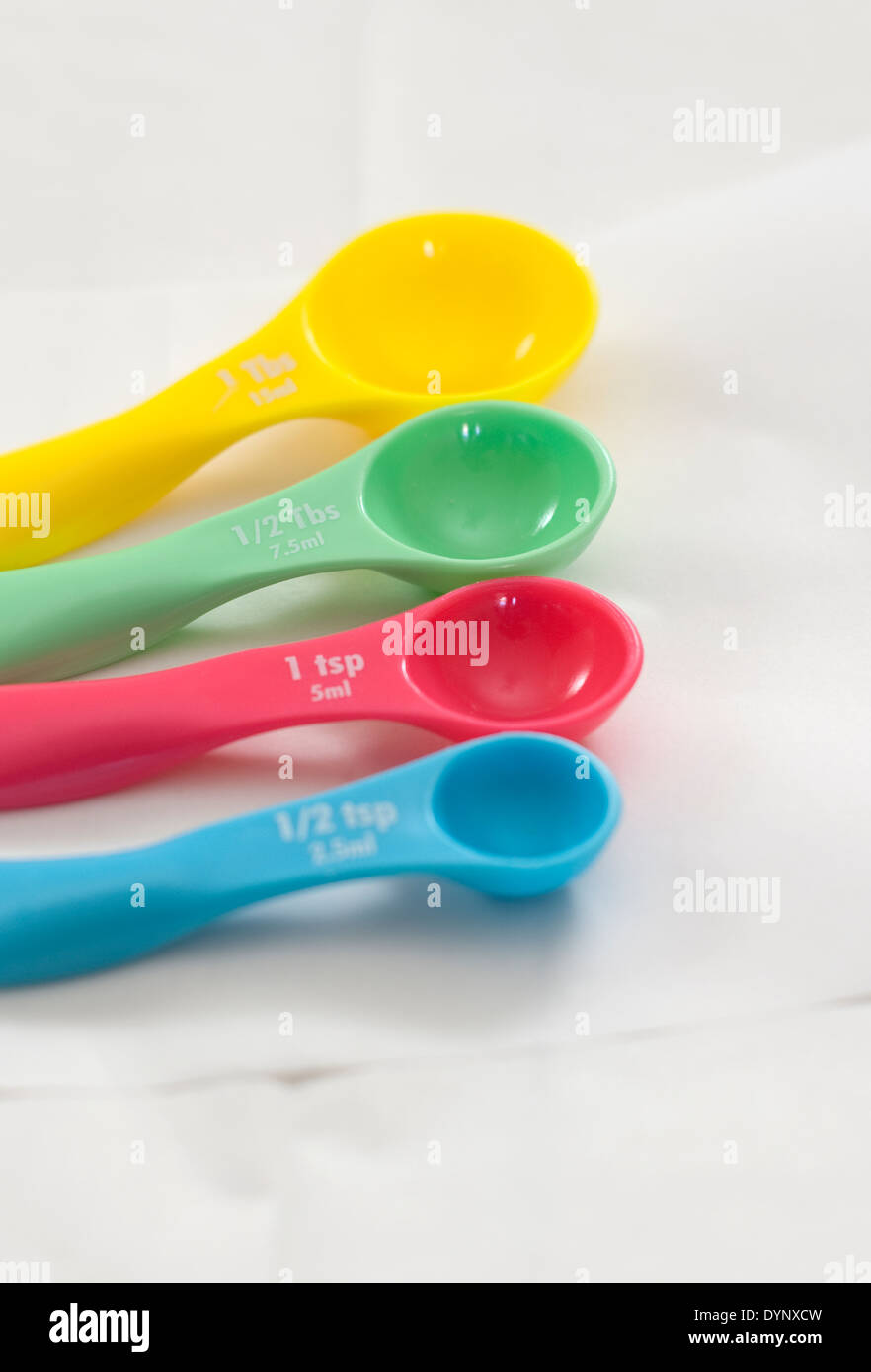 Still life food image of plastic measuring spoons Stock Photo - Alamy