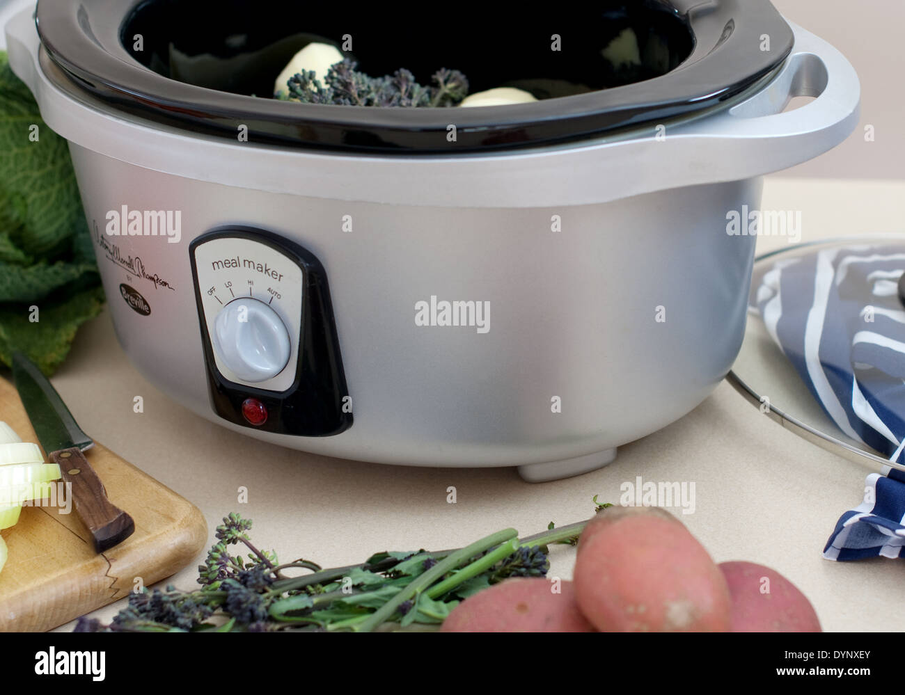 Still life food image of a slow cooker and vegetables Stock Photo - Alamy