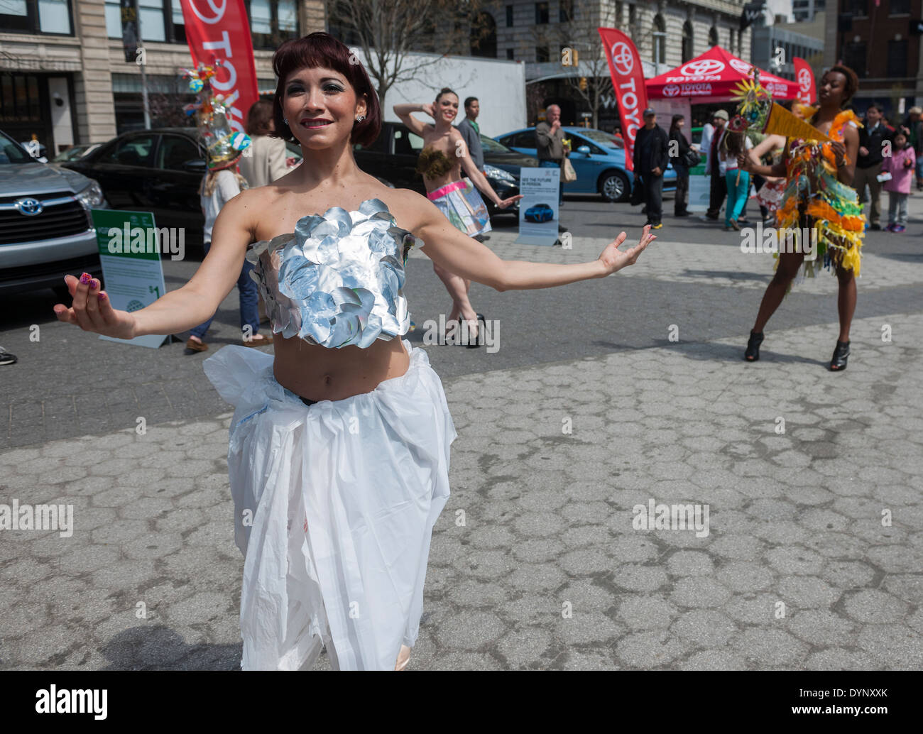 Dancers dressed in costumes made from recycled material perform in ...