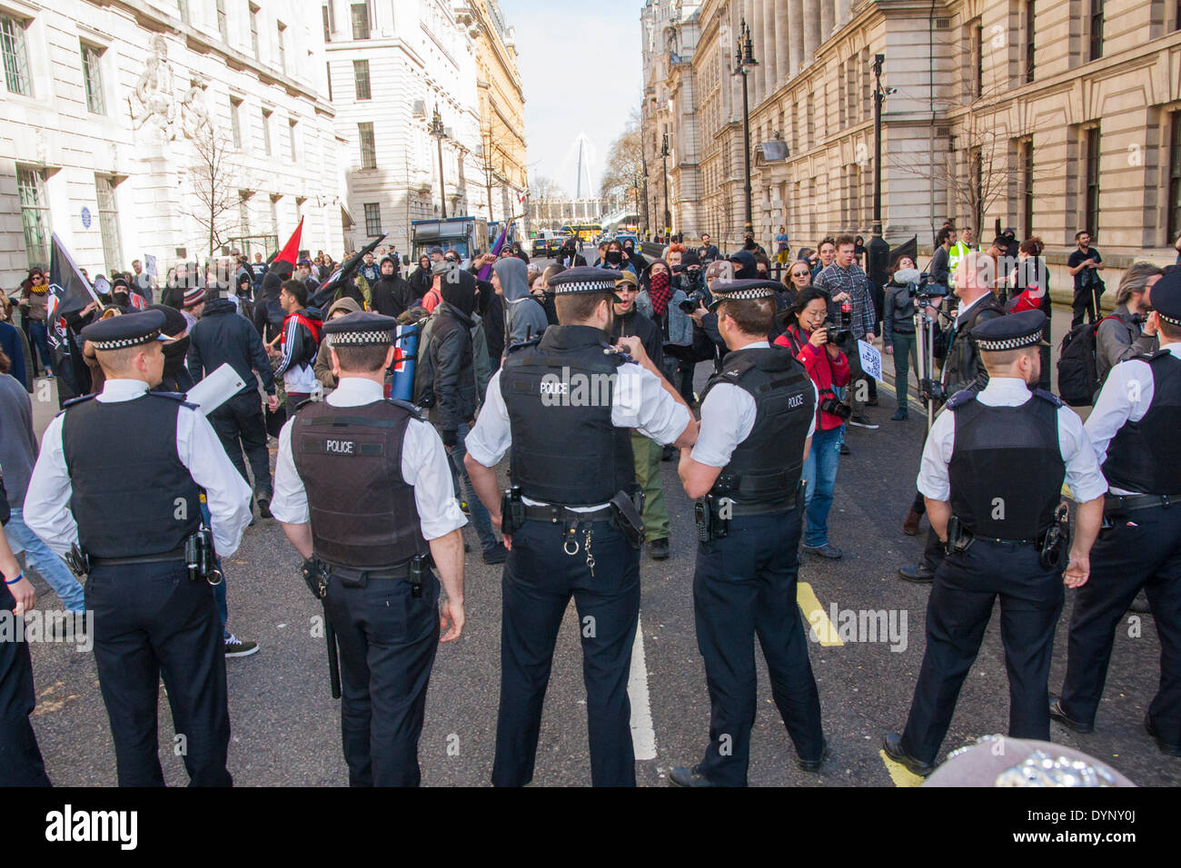 London, March 15th 2014. Police block a charge by anti-fascist counter ...