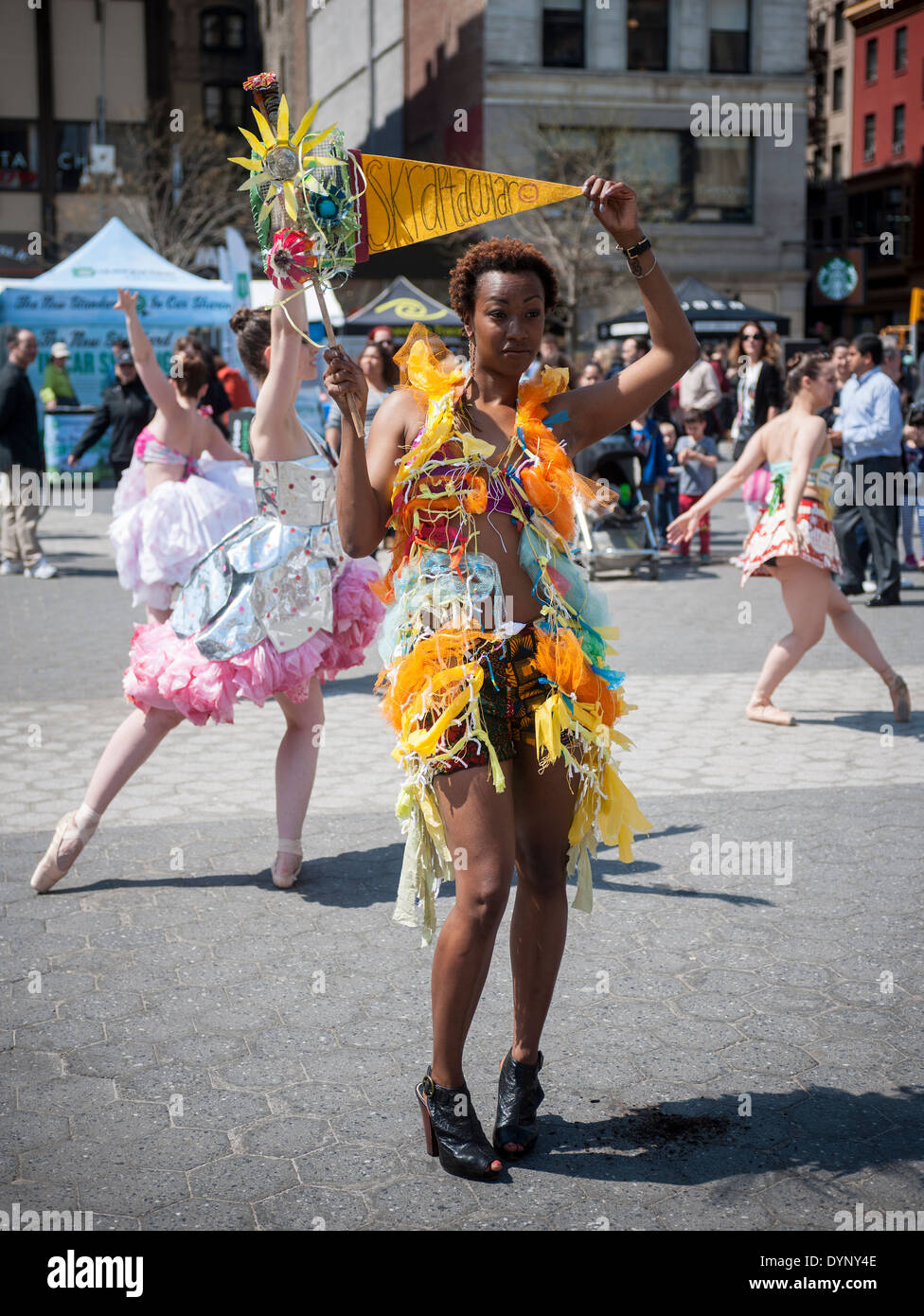 Dancers dressed in costumes made from recycled material perform in ...