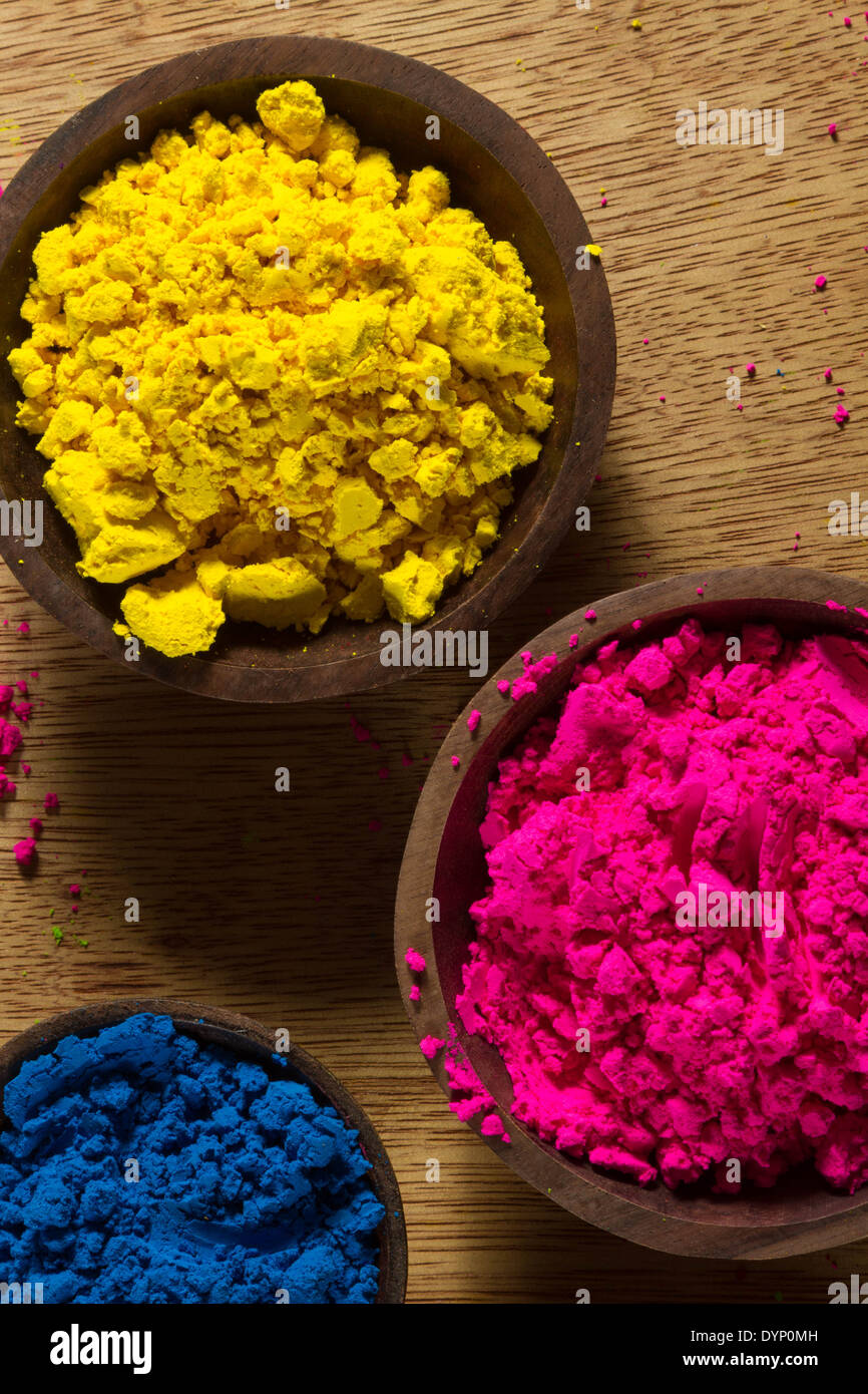 Colorful, finely powdered Indian pigments. Yellow, magenta and blue ...