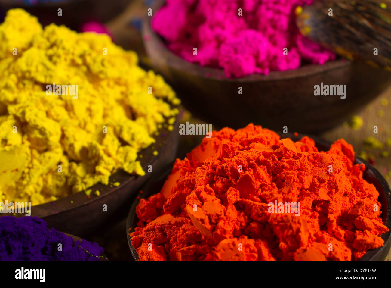 Colorful, finely powdered Indian pigments. Focus on bright orange Stock ...